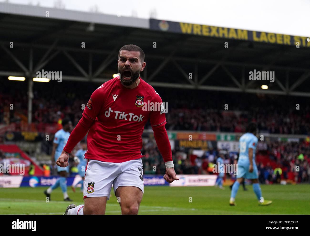 Wrexham's Elliott Lee celebrates scoring their side's first goal of the ...