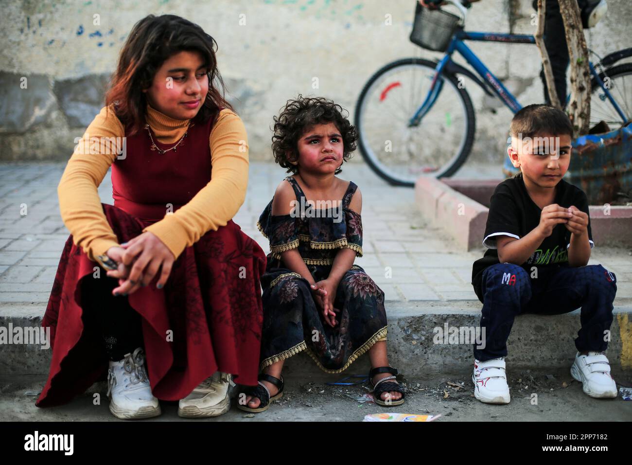 Baghdad, Iraq. 22nd Apr, 2023. Iraqi children sit at a local park ...