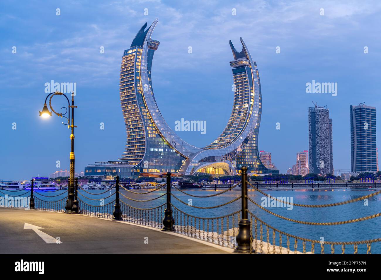 Katara buildings view from Lusail Marina Park. Crescent Tower Stock ...