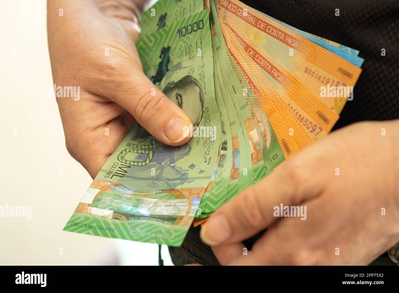 Costa Rica, Bundle of Banknotes in Hands, Lots of Money, Costa Rican ...
