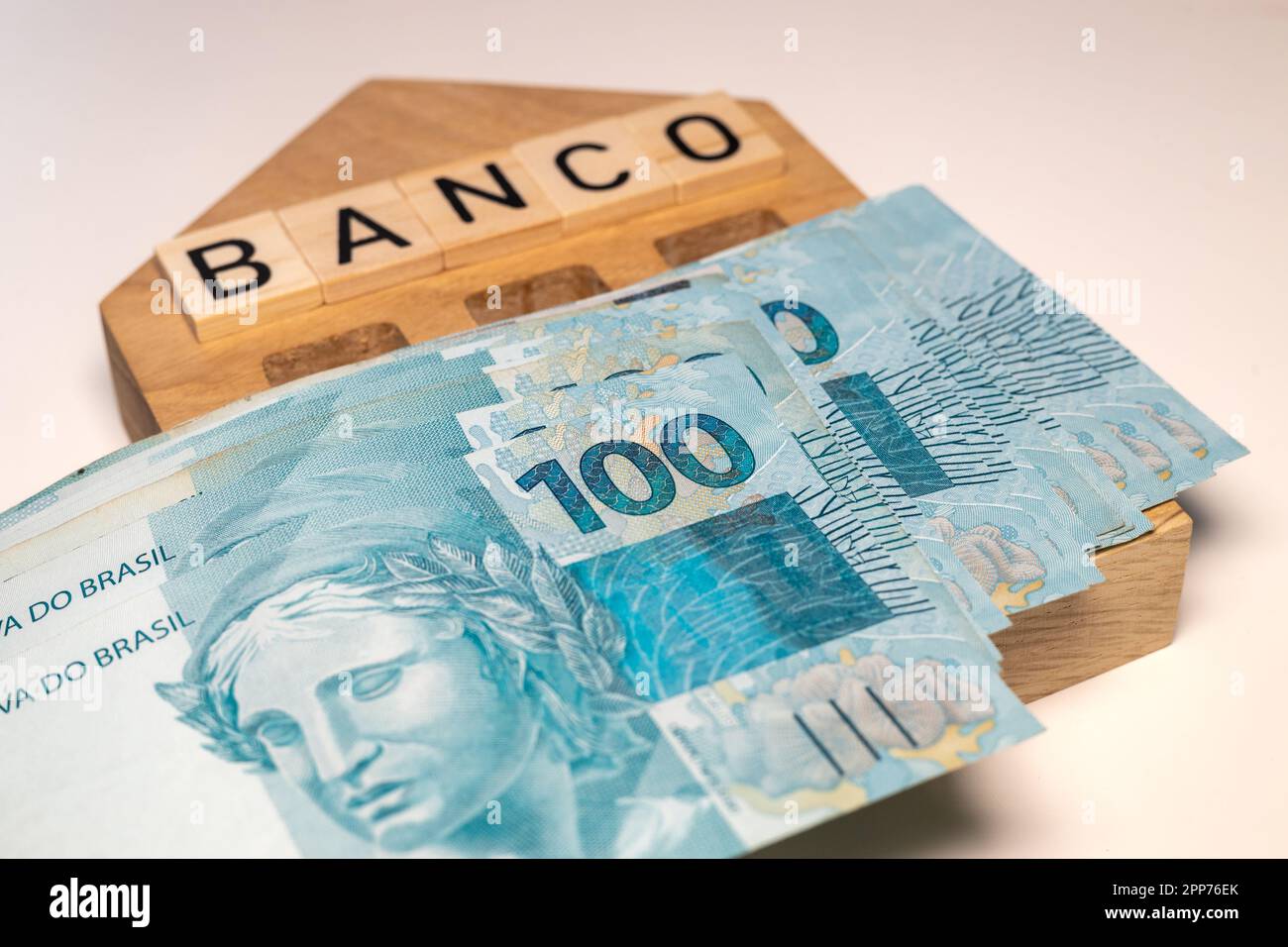 Brazilian money and the symbol of the bank of Brazil wooden miniature ...