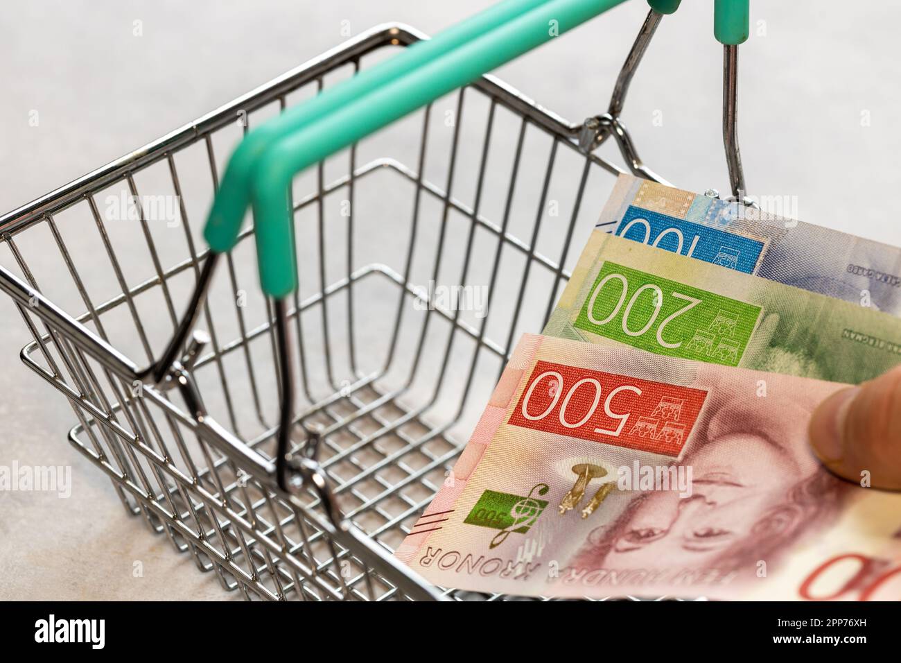 Concept, inflation in sweden, Empty shopping cart and bundle of swedish ...