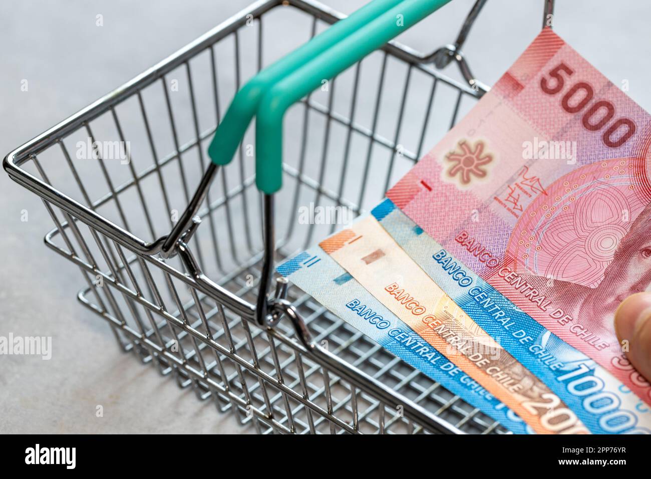 Concept, Chile inflation, Empty shopping cart and chile pesos file, close up Stock Photo - Alamy