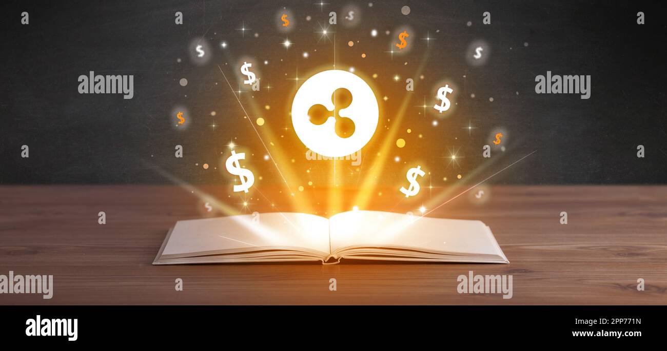Open book with currency icons above Stock Photo - Alamy