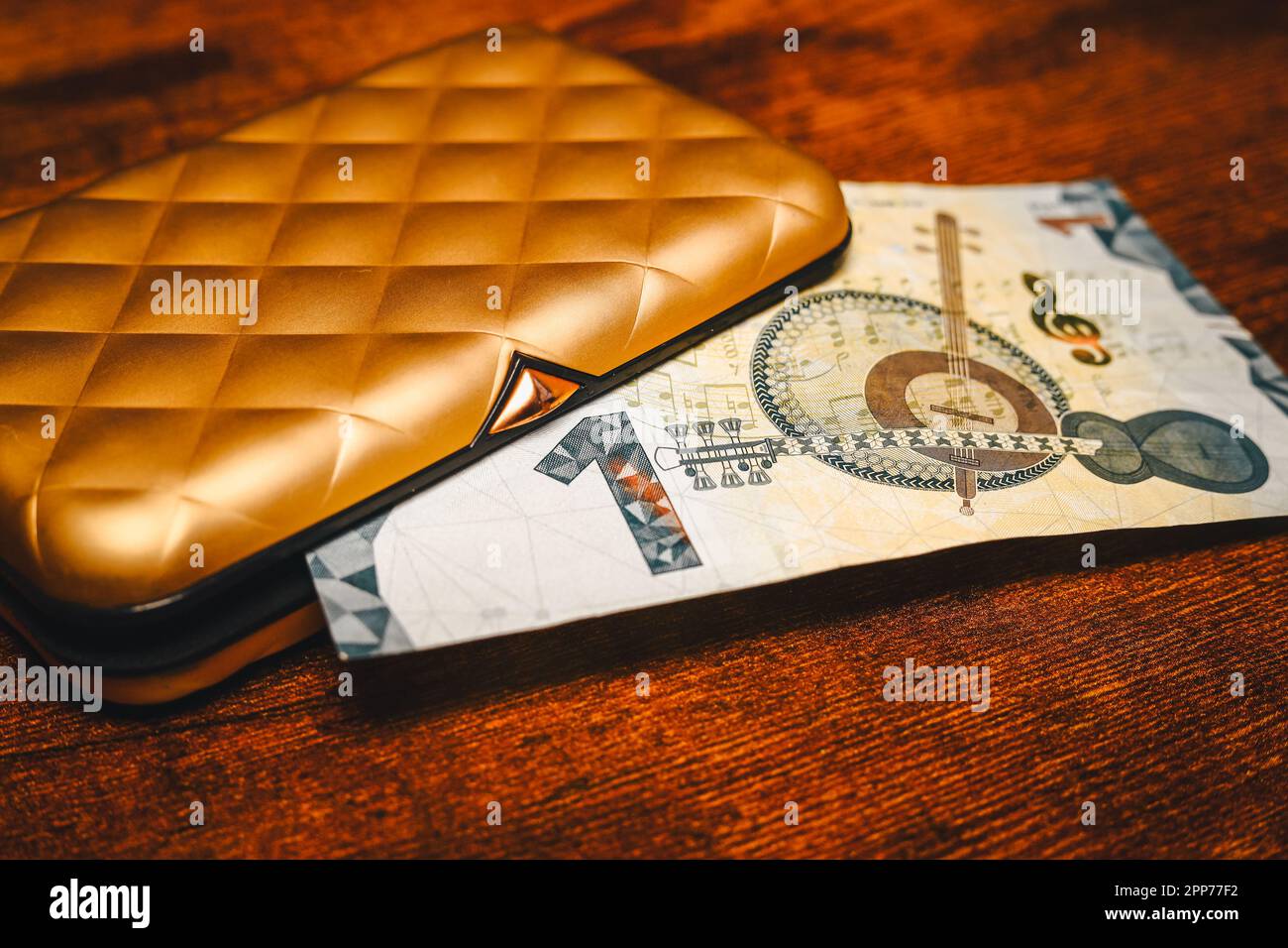 Azerbaijan money, 1 manat banknote sticking out of a beautiful gold ...