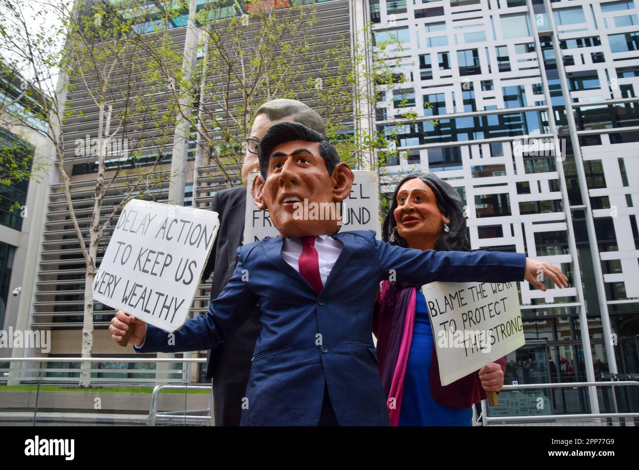 London, UK. 22nd April 2023. Protesters wearing Rishi Sunak, Suella ...