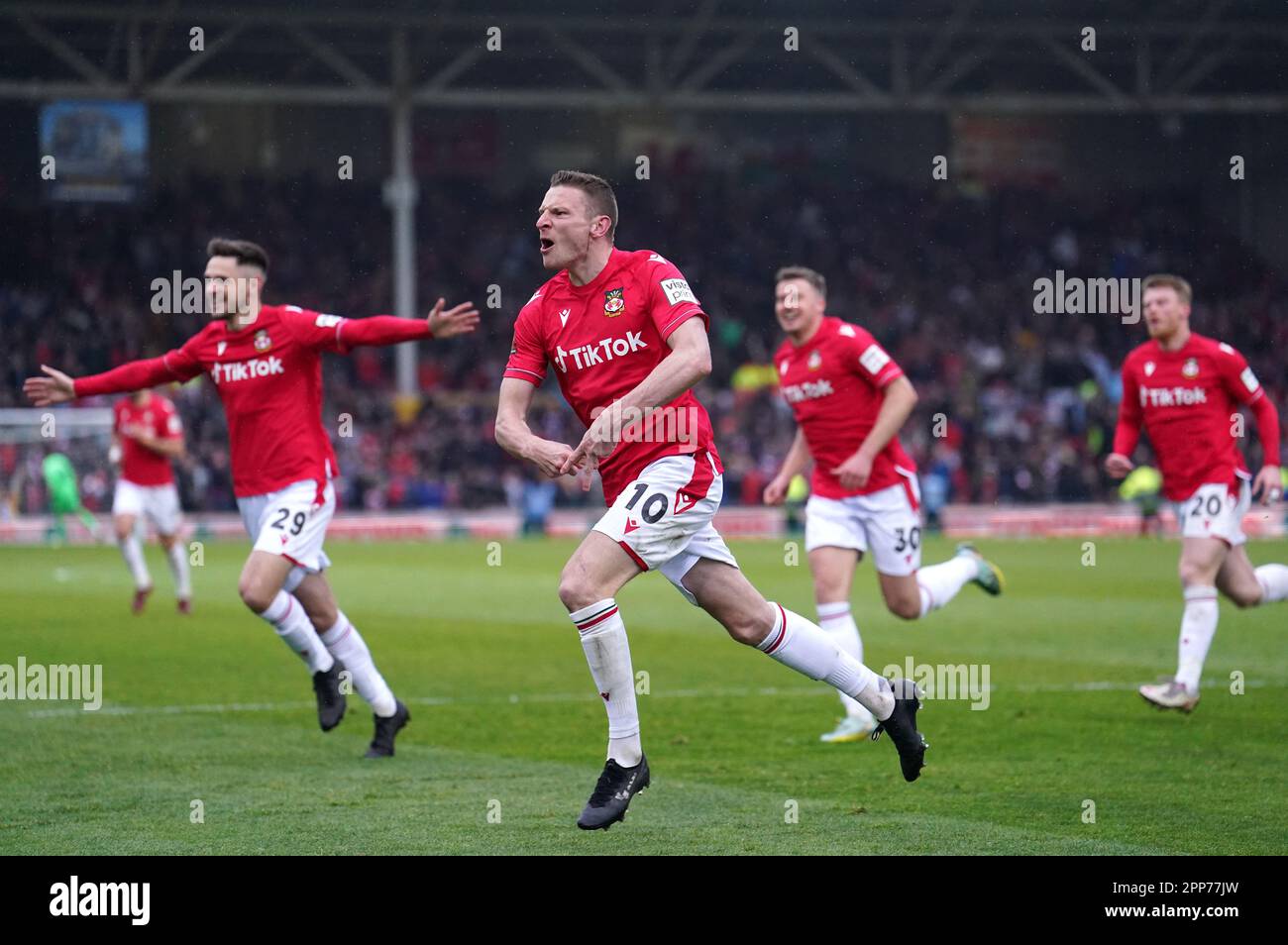 Wrexham's Paul Mullin (second left) bcelebrates scoring their side's ...