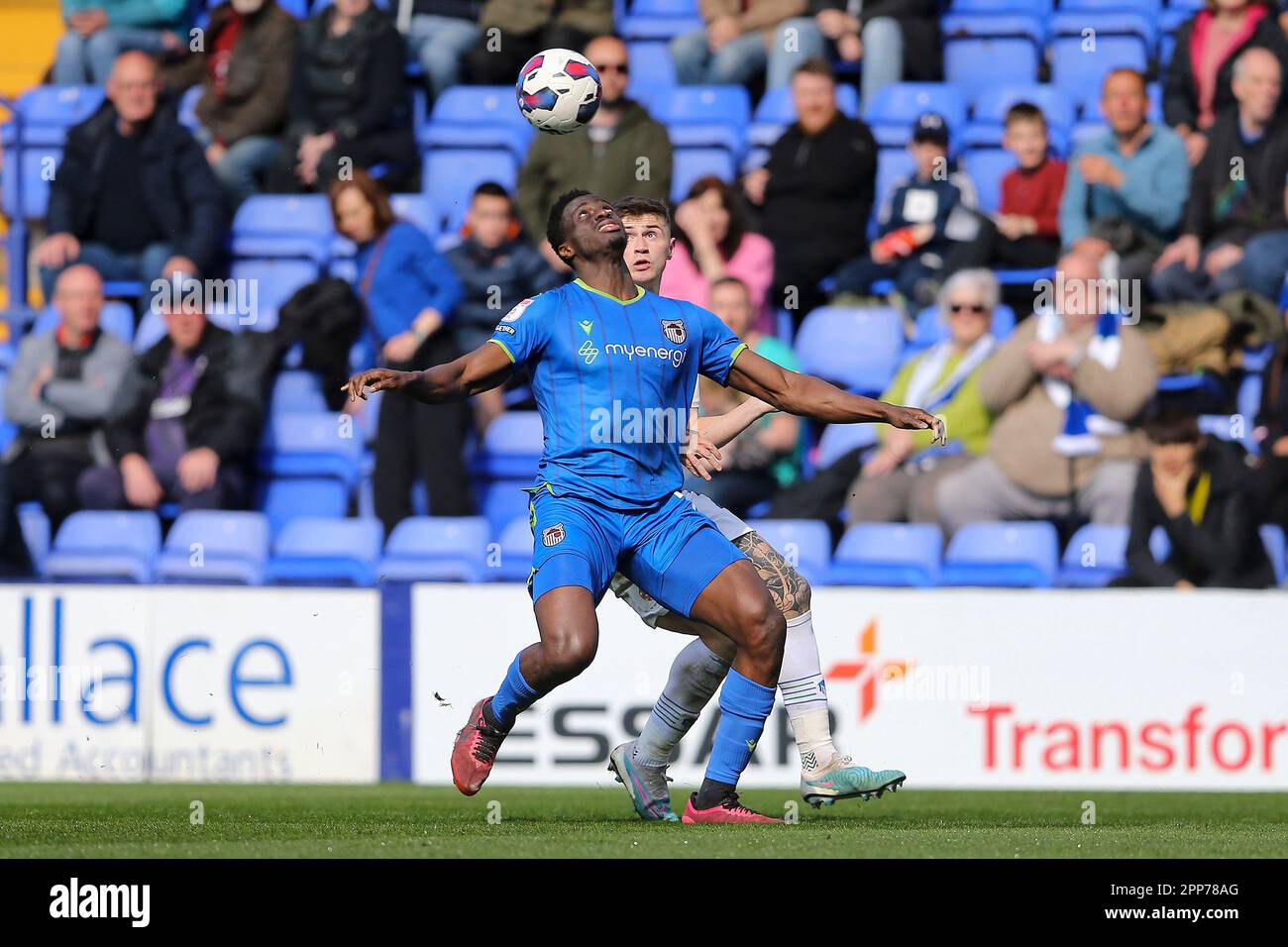 Birkenhead, UK. 22nd Apr, 2023. Josh Emmanuel of Grimsby Town shields ...