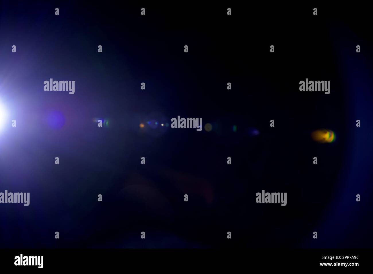 glare from a lantern with rays of light in the dark Stock Photo - Alamy