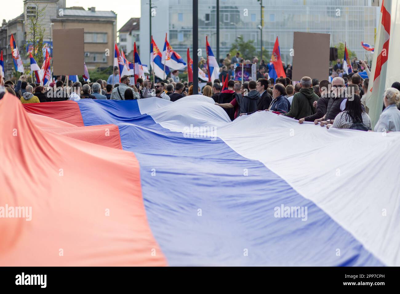 Political rally of people waves big serbian flag. Protest in front of ...