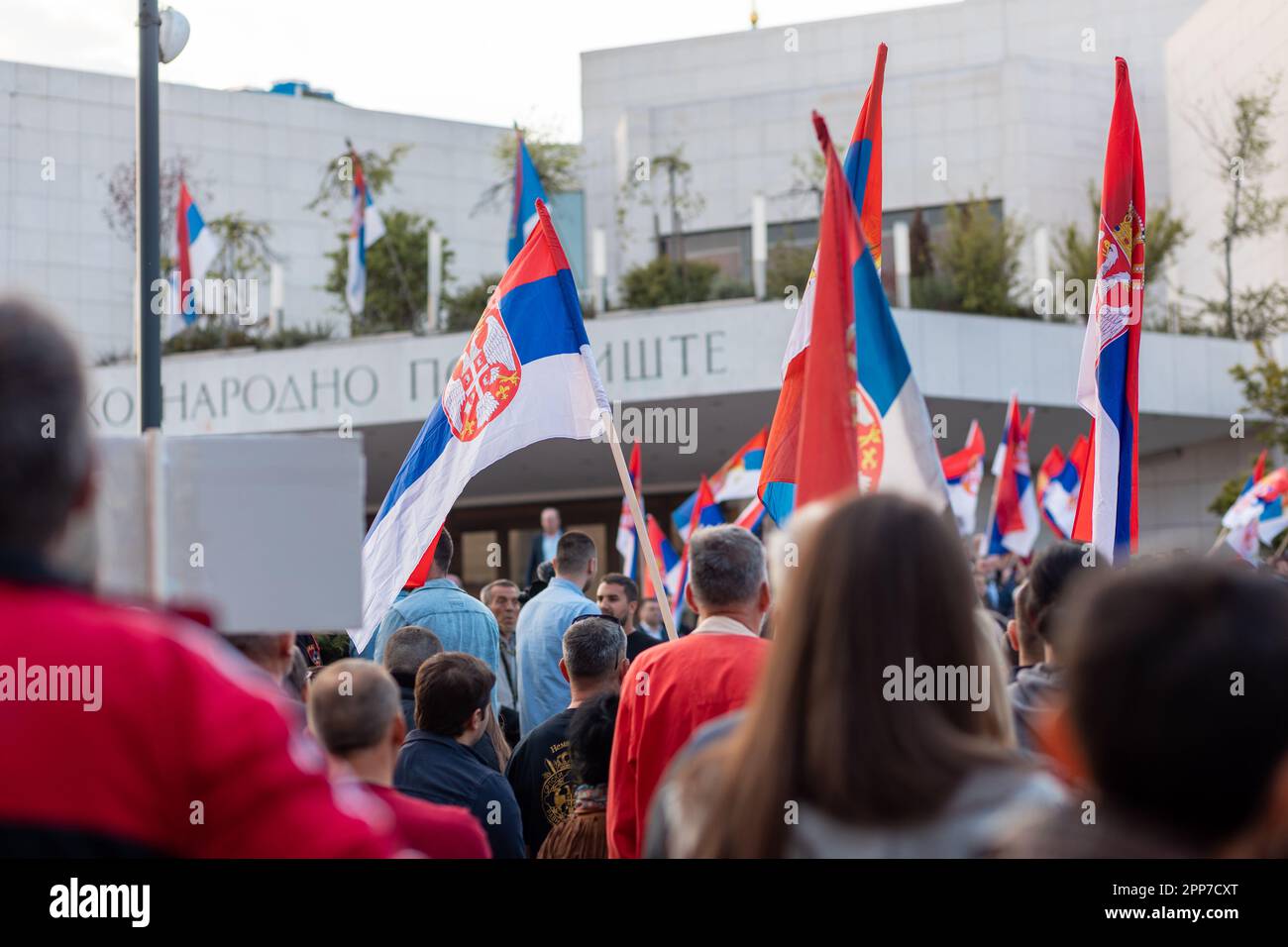 Political rally of people in front of main building. Men patriots holds ...