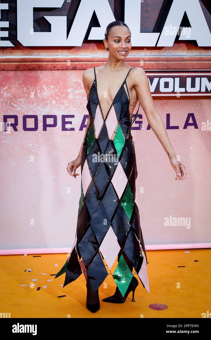 Zoe Saldana poses for the media upon their arrival at the gala event ...