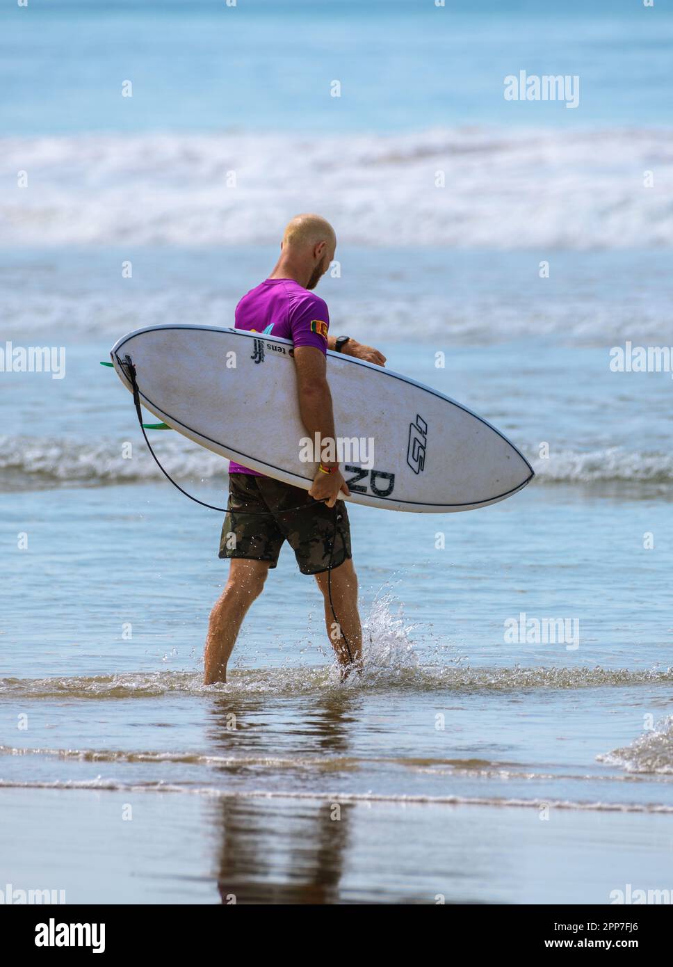 Ahangama, Sri Lanka - 03 26 2023: Pro surfer enters the Red Bull ride ...