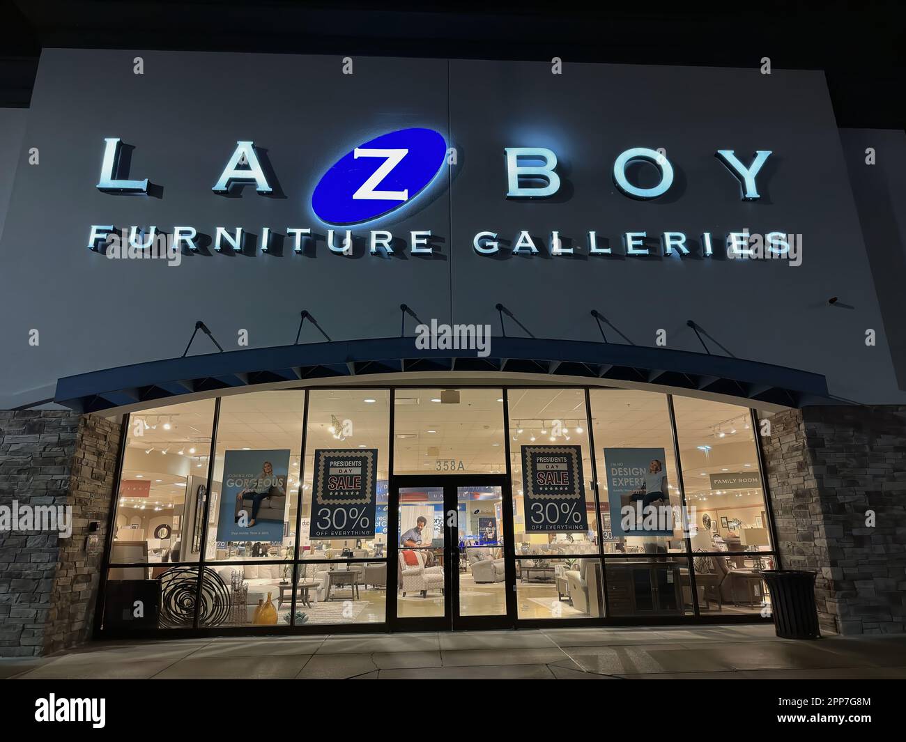 Lazboy furniture retailer storefront window and entrance, night time ...