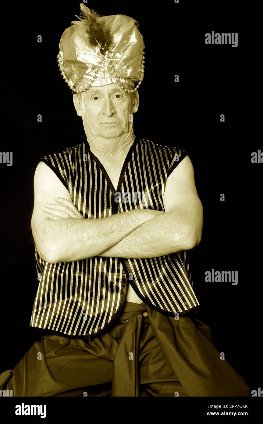 An elder sultan or shiek isolated over black Stock Photo - Alamy