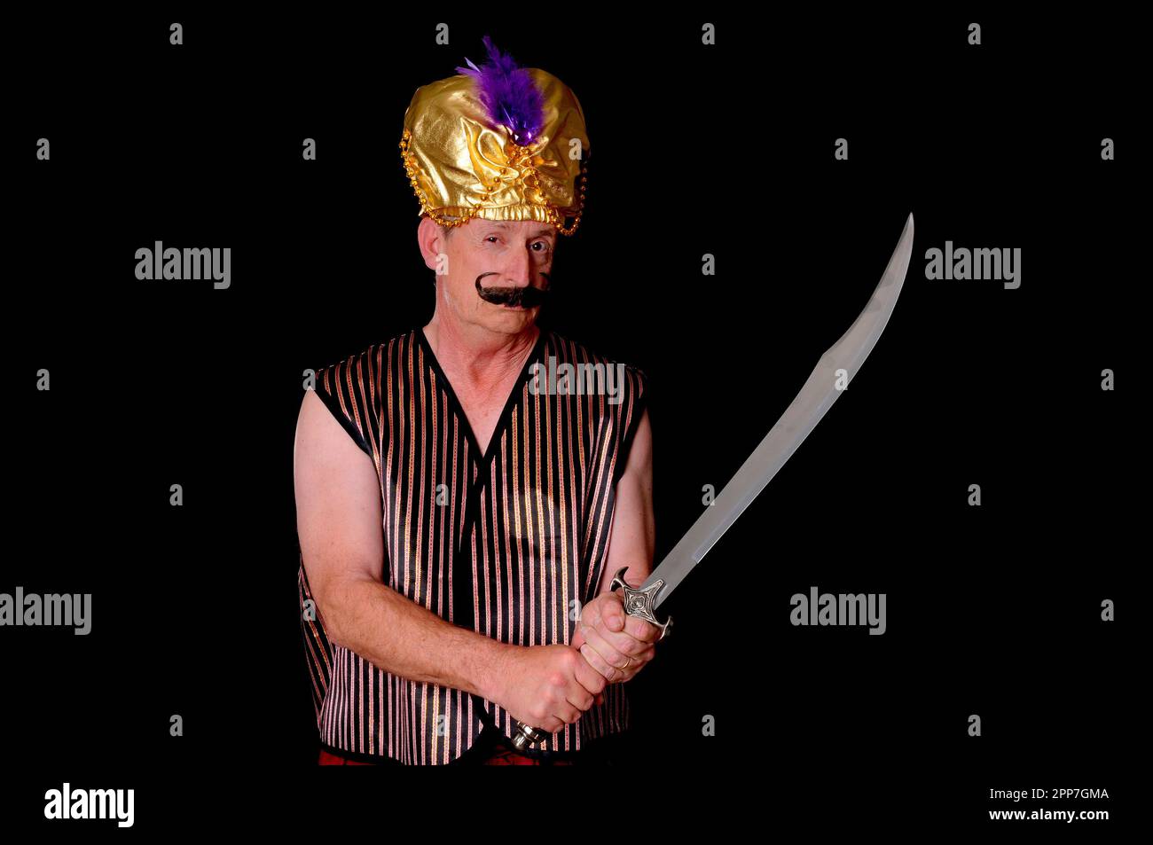 An elder sultan or shiek with a sword isolated over black Stock Photo ...