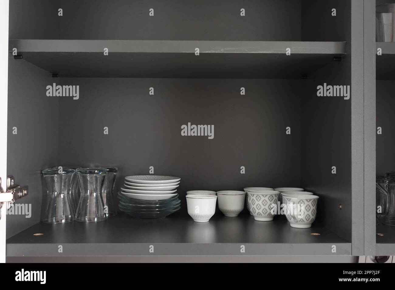 White Dishes and Bowls in Kitchen Cabinet Stock Photo - Alamy