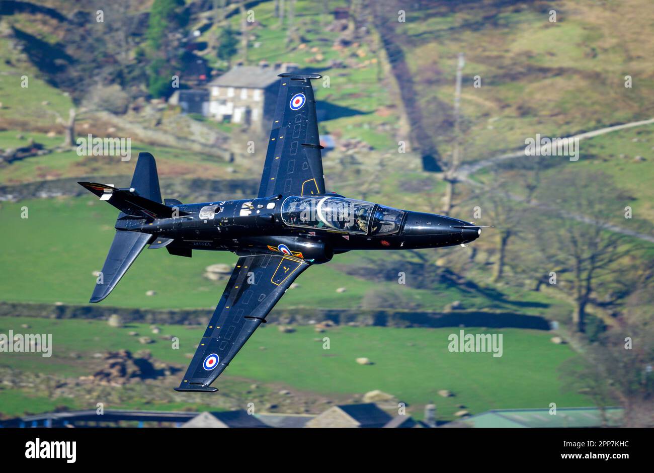Royal Air Force Hawk T2 jet trainer navigating through low flying area ...