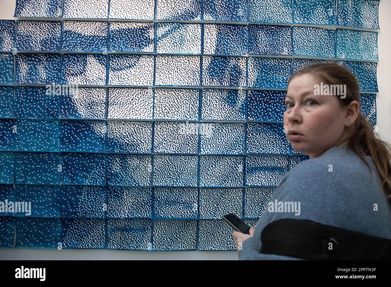 Moscow, Russia. 22nd of April, 2023. A woman is seen by works by the ...