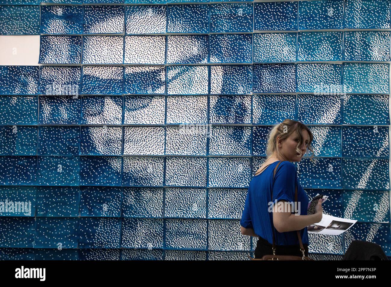 Moscow, Russia. 22nd of April, 2023. A woman is seen by works by the ...