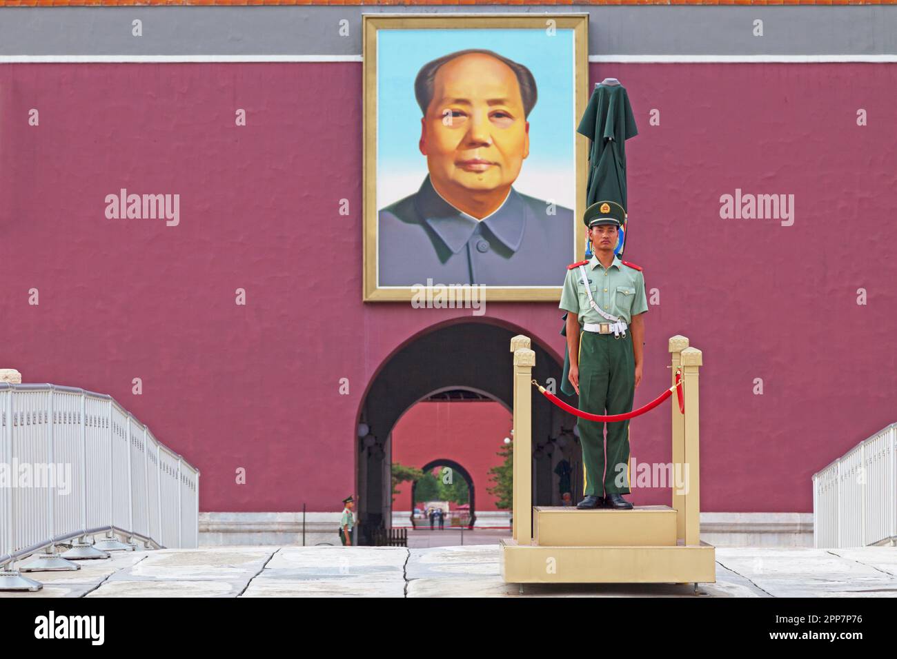 Beijing, China - August 08 2018: Guard with behind the portrait of Mao ...