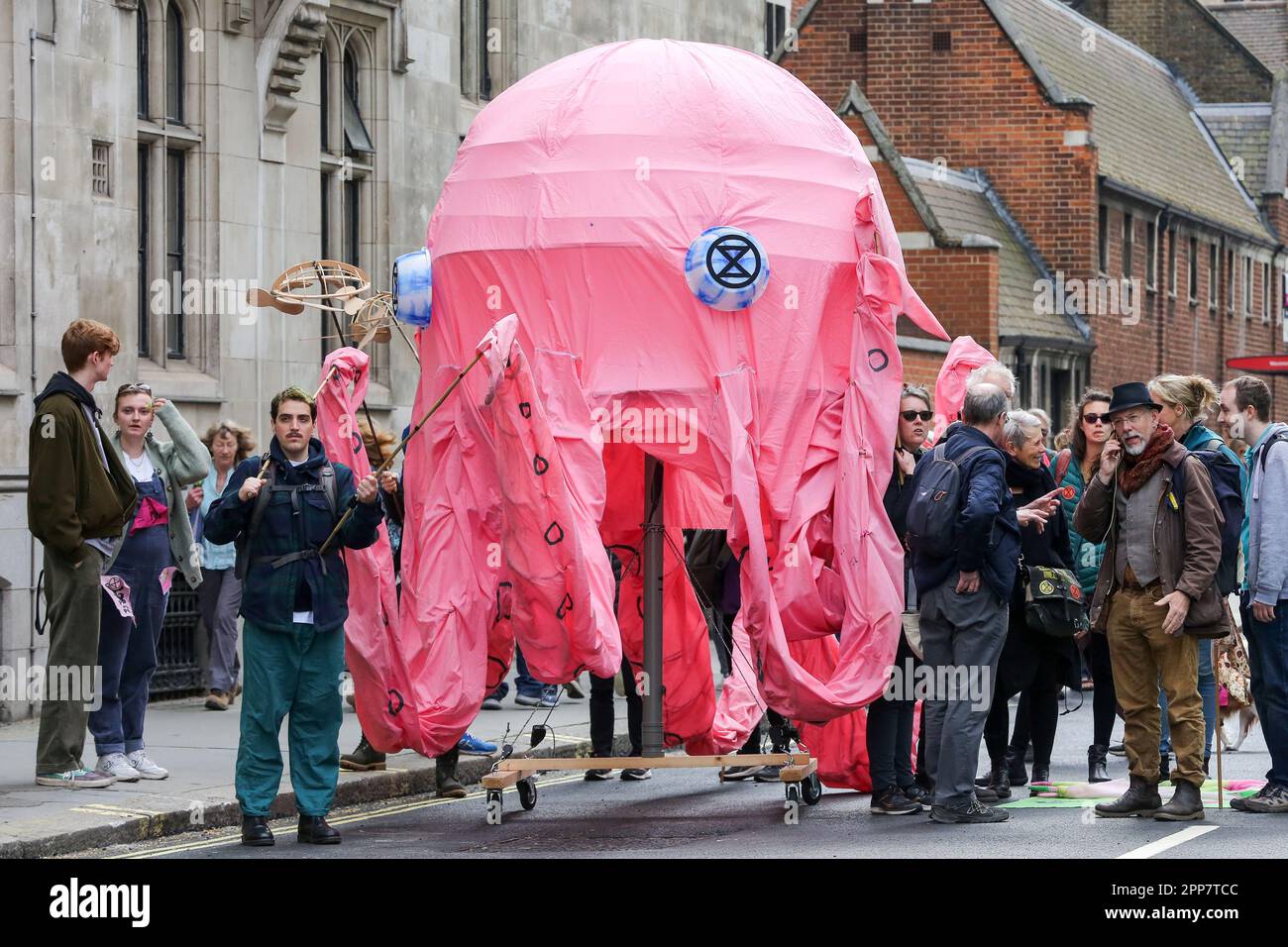 London, UK. 22nd Apr, 2023. Protesters with a giant model of octopus ...