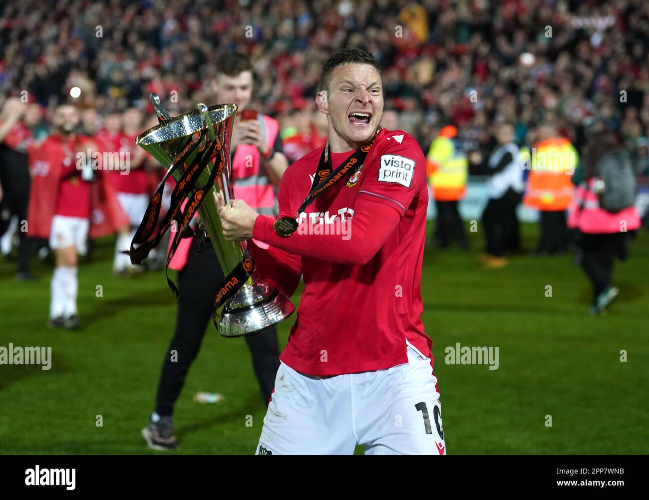 Wrexham's Paul Mullin celebrates with the trophy after promotion to the ...