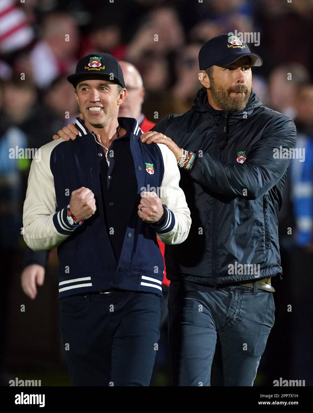 Wrexham co-owners Rob McElhenney and Ryan Reynolds celebrate following promotion to the EFL ...