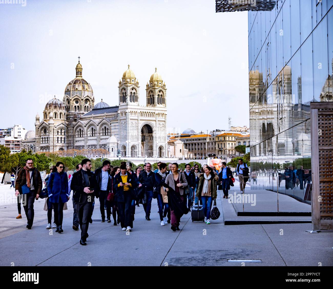 visitors on the seafront near the Byzantine style Marseille Cathedral ...