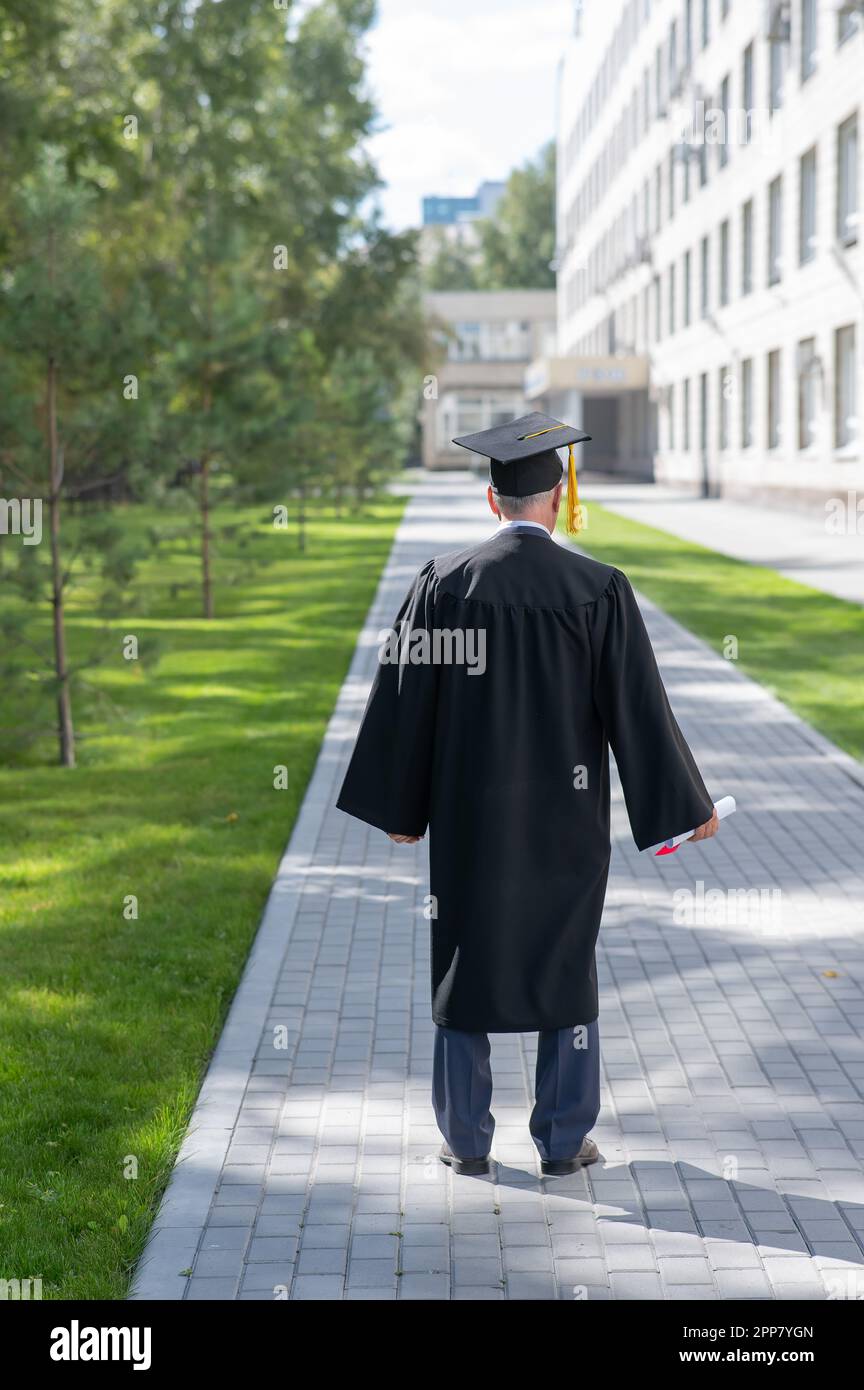 College dean in graduation gown hi-res stock photography and images - Alamy