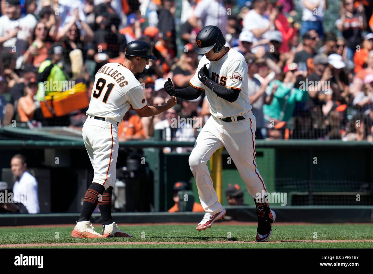 San Francisco Giants' Wilmer Flores, right, celebrates with third base ...