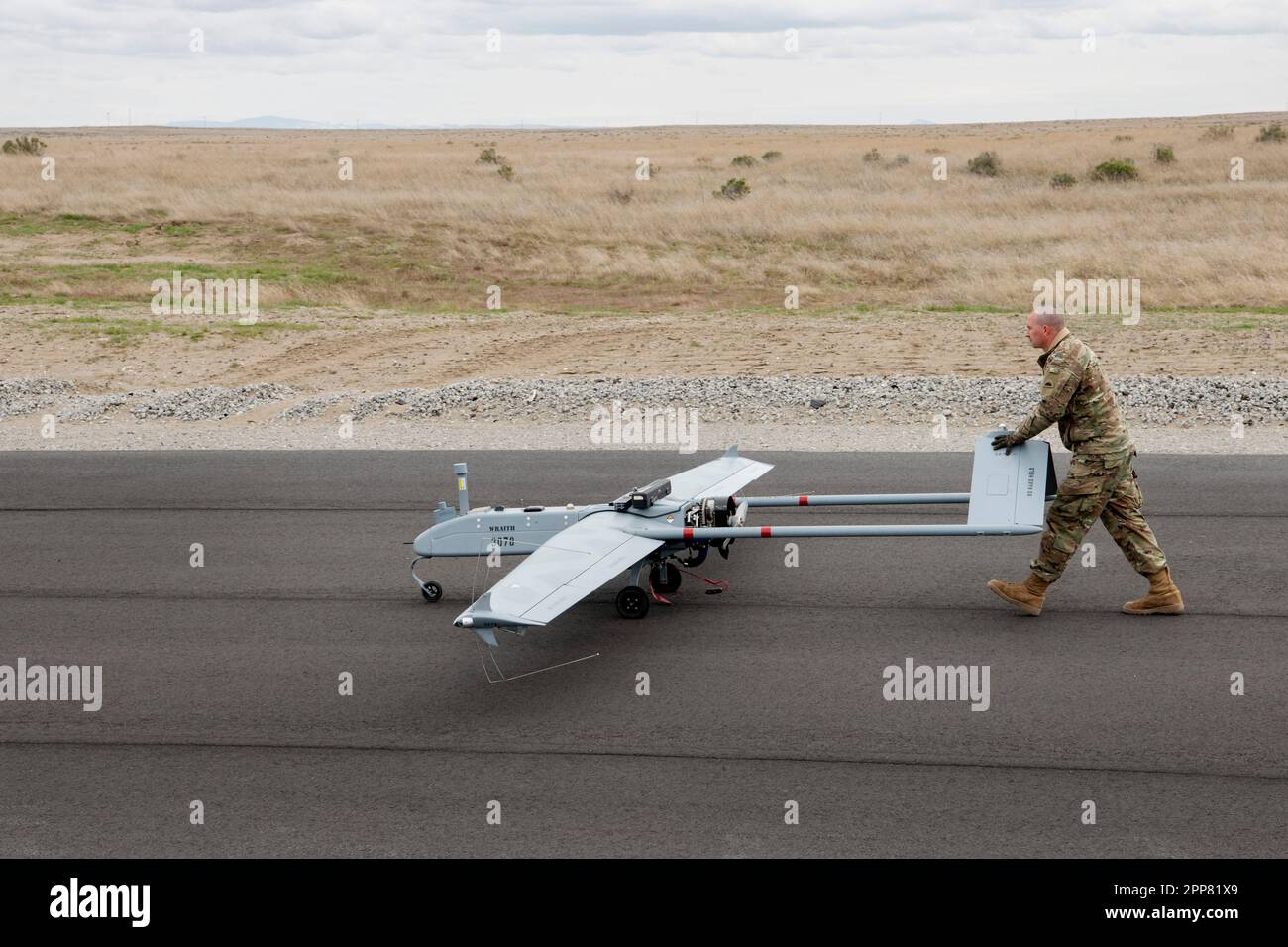 Oregon Army National Guard Staff Sgt. Timothy Powers pushes an RQ-7B ...
