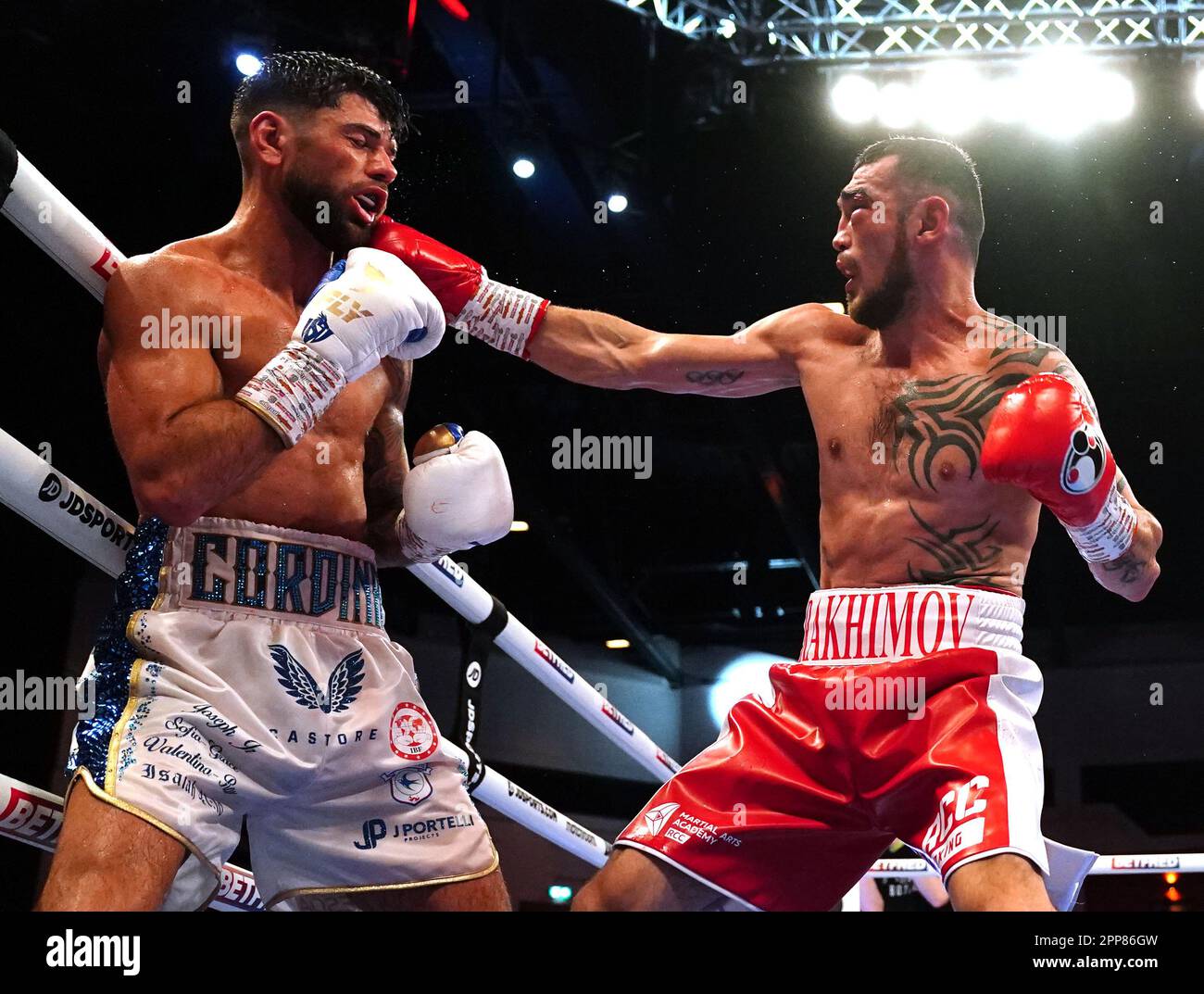 Joe Cordina (left) and Shavkatdzhon Rakhimov in the IBF World Super Feather weight bout at ...