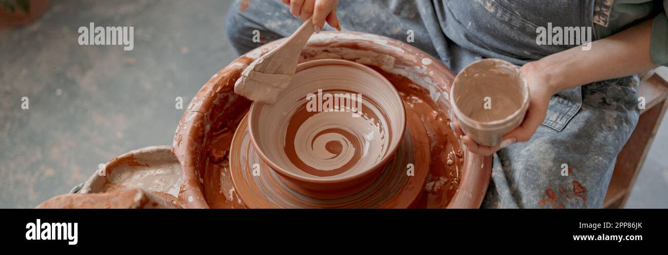 Skillful ceramist working with pottery at ceramic workshop Stock Photo ...