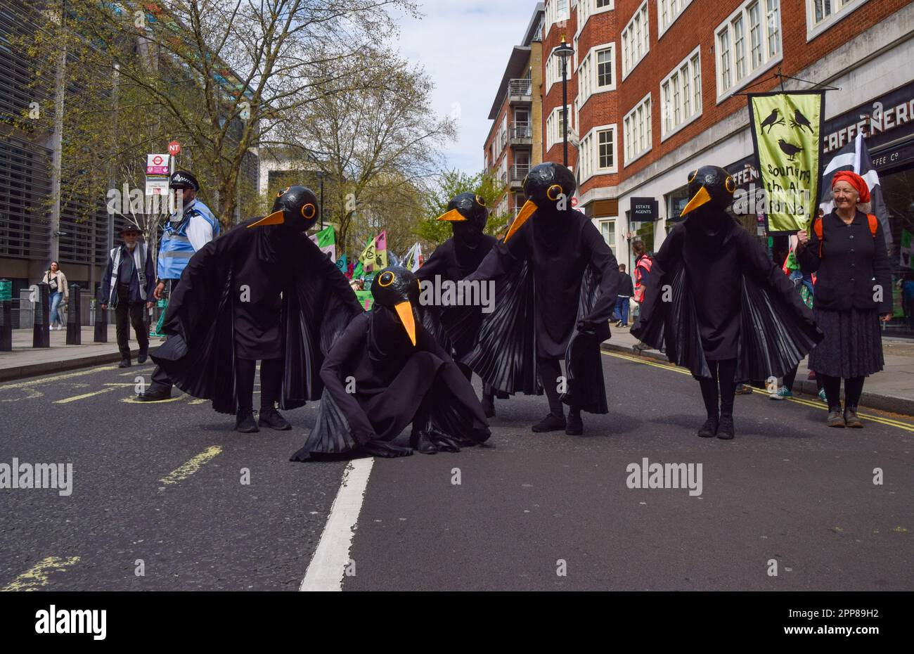 London, UK. 22nd Apr, 2023. Protesters wearing bird costumes perform ...