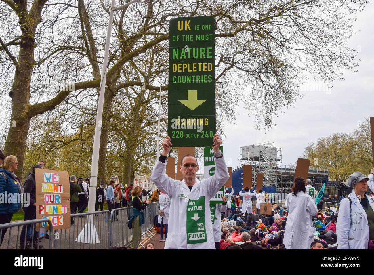 London, UK. 22nd Apr, 2023. A protester holds a placard which states ...