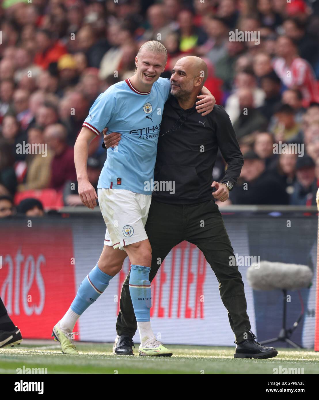 London, UK. 22nd Apr, 2023. Erling Haaland (MC) and Pep Guardiola (Man City manager) hug at the ...