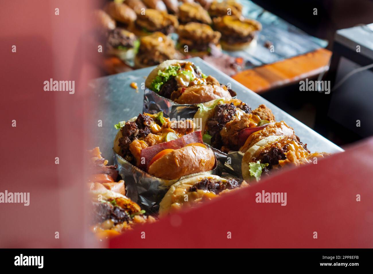 gourmet burger being prepare on hamburger bar kitchen Stock Photo - Alamy