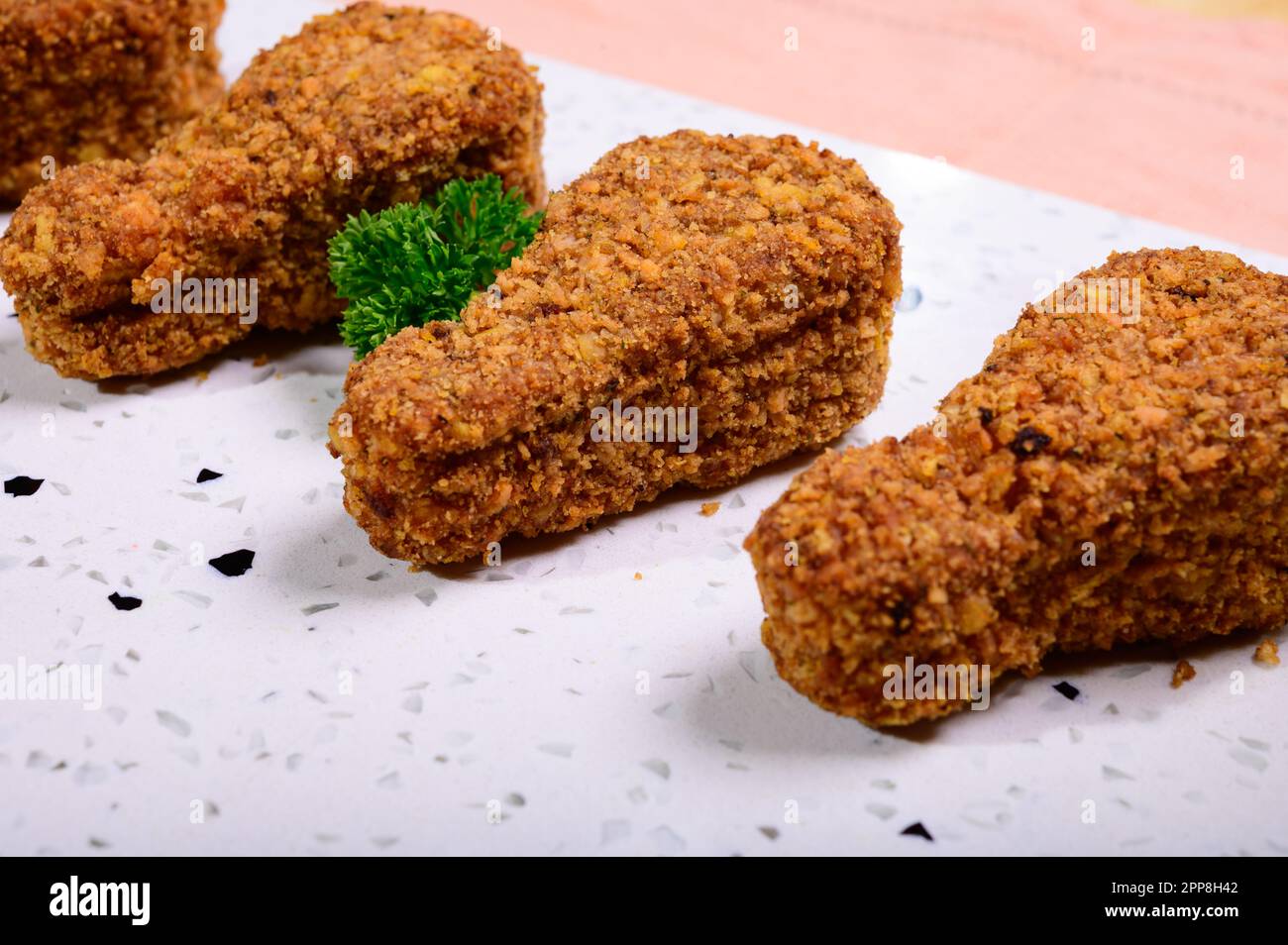 Tasty vegetarian vegan meat free chicken thighs, healthy food close up ...