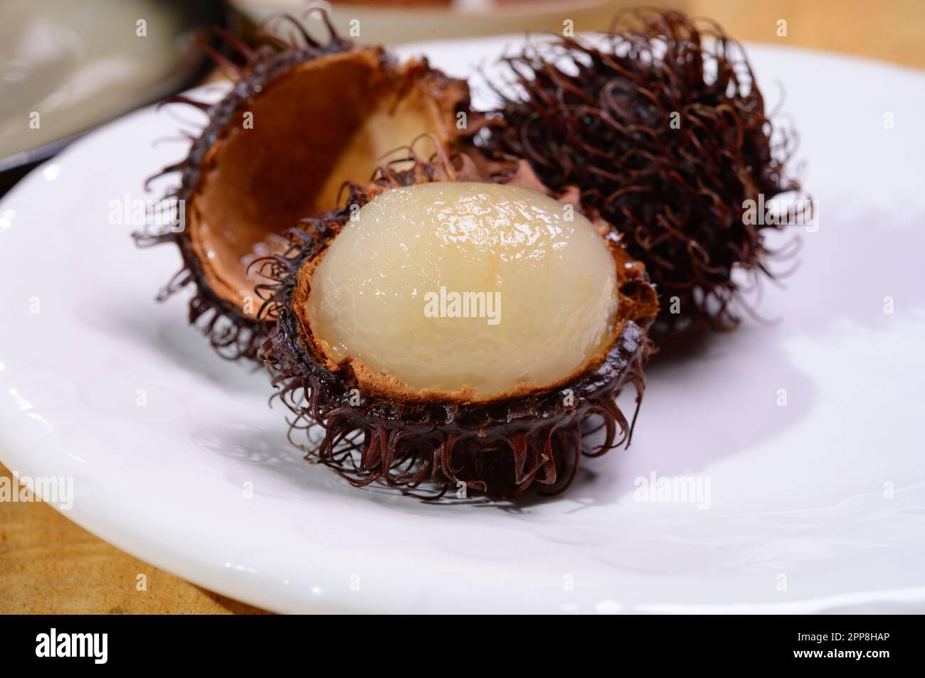 Tasty tropical exotic fruits, sweet ripe fresh peeled and unpeeled ...