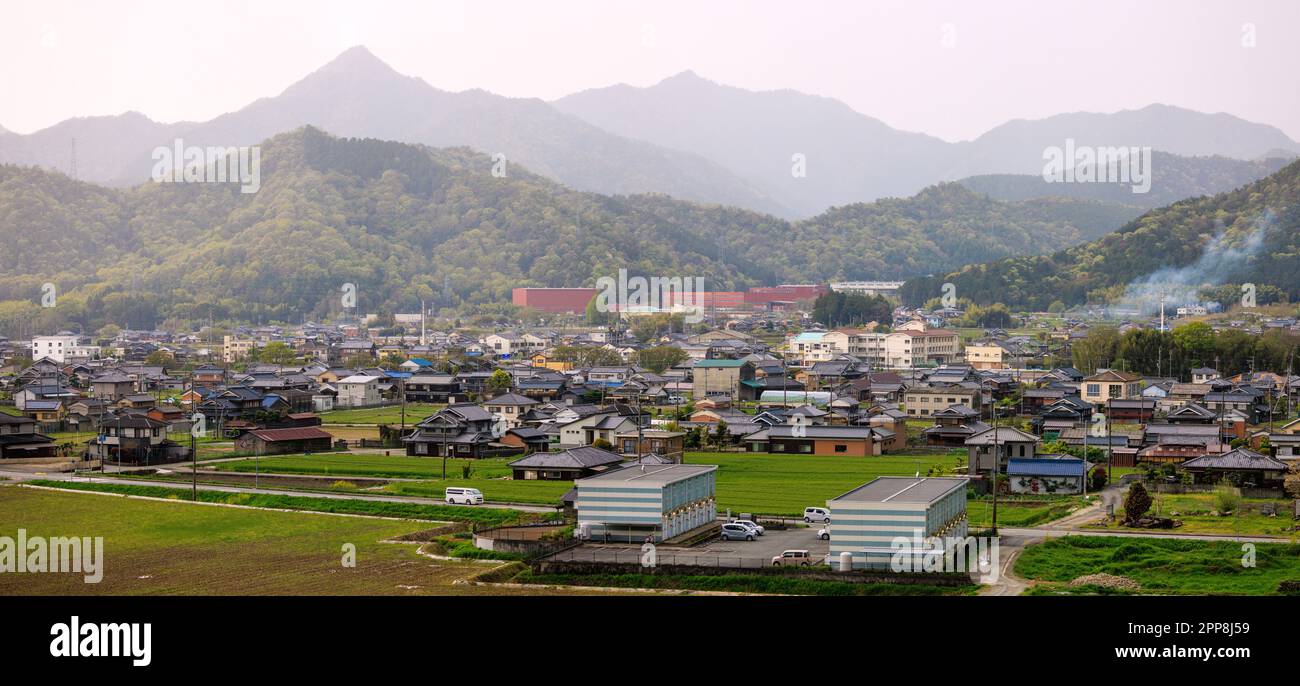 Apartments and houses in small town in rural valley between mountains ...