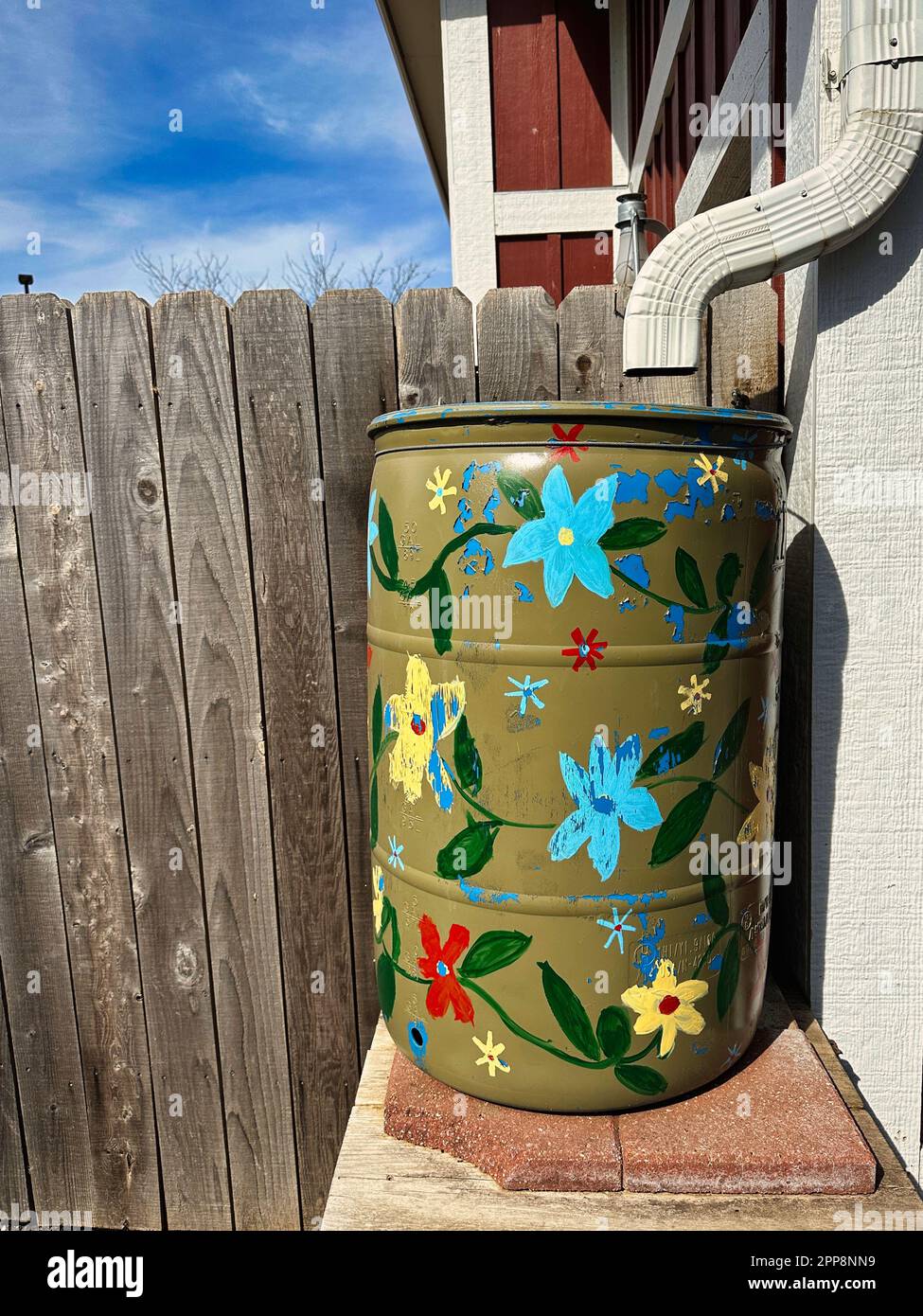 Painted Flowers on Green Rain Barrel by Wood Fence - Sustainable living ...