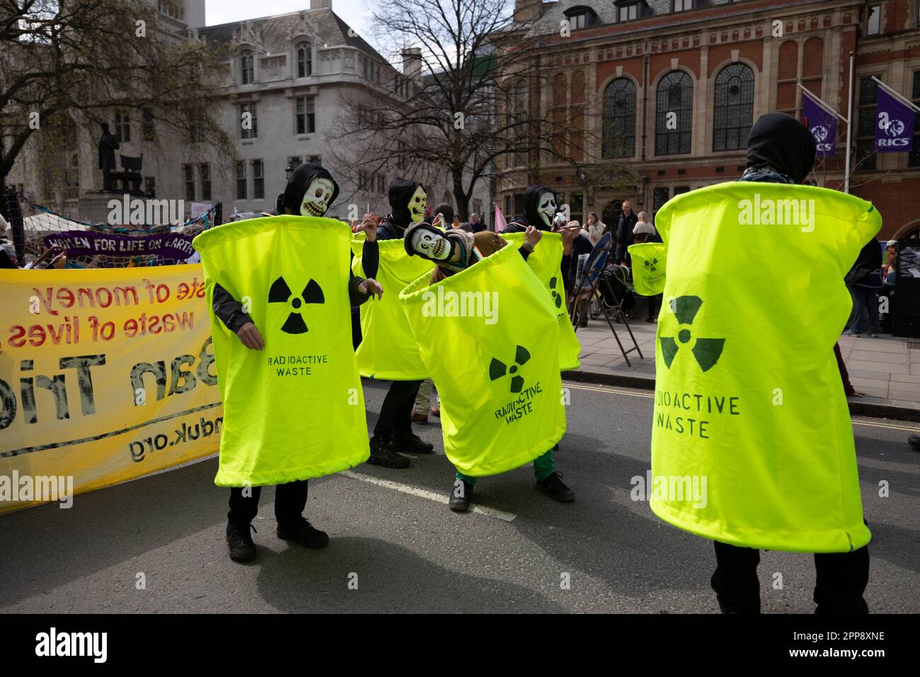 London, UK. 22nd Apr, 2023. Protesters seen dressing as radioactive ...
