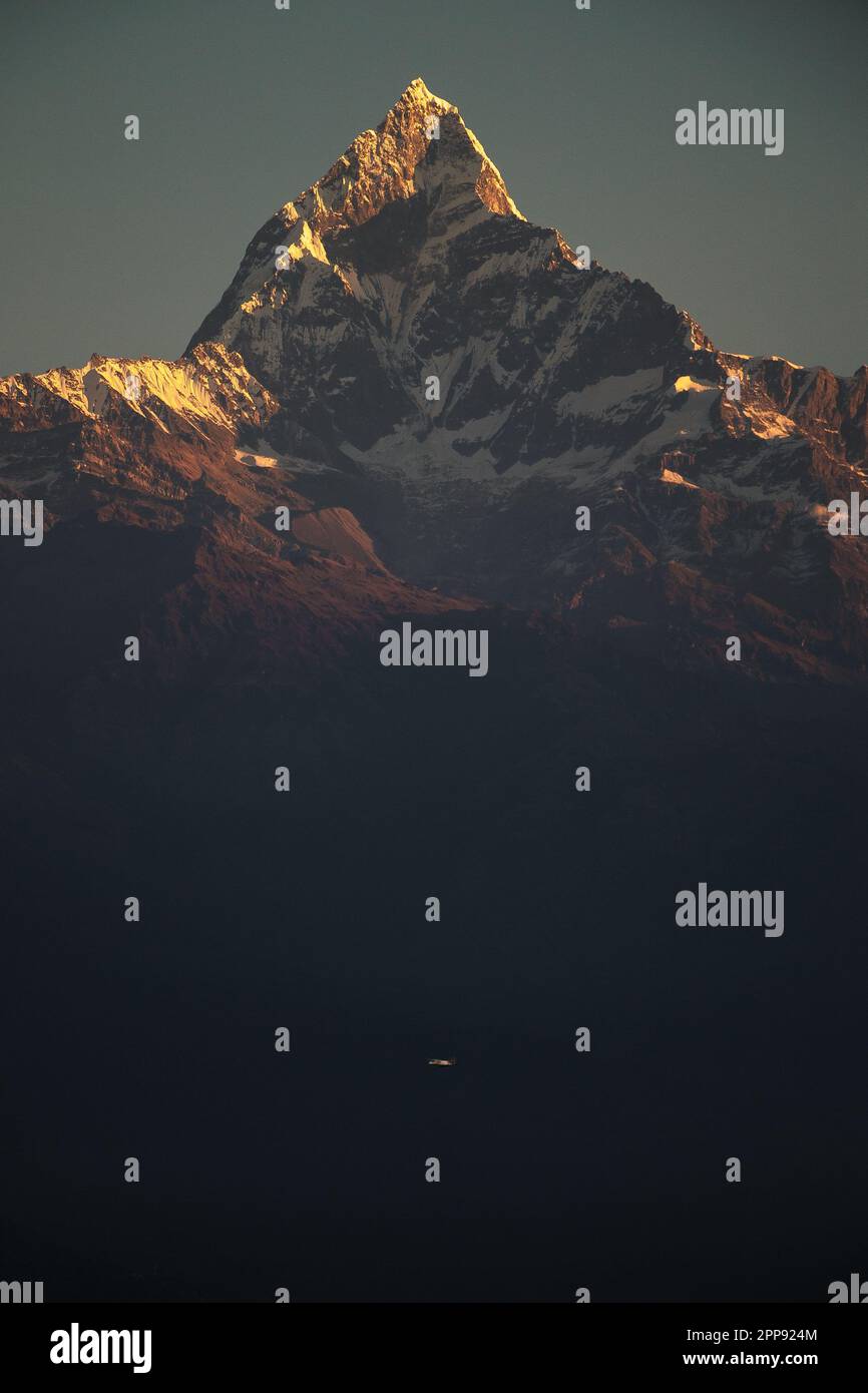 A stunning view of the Machhapuchhare mountain range at sunset, in ...