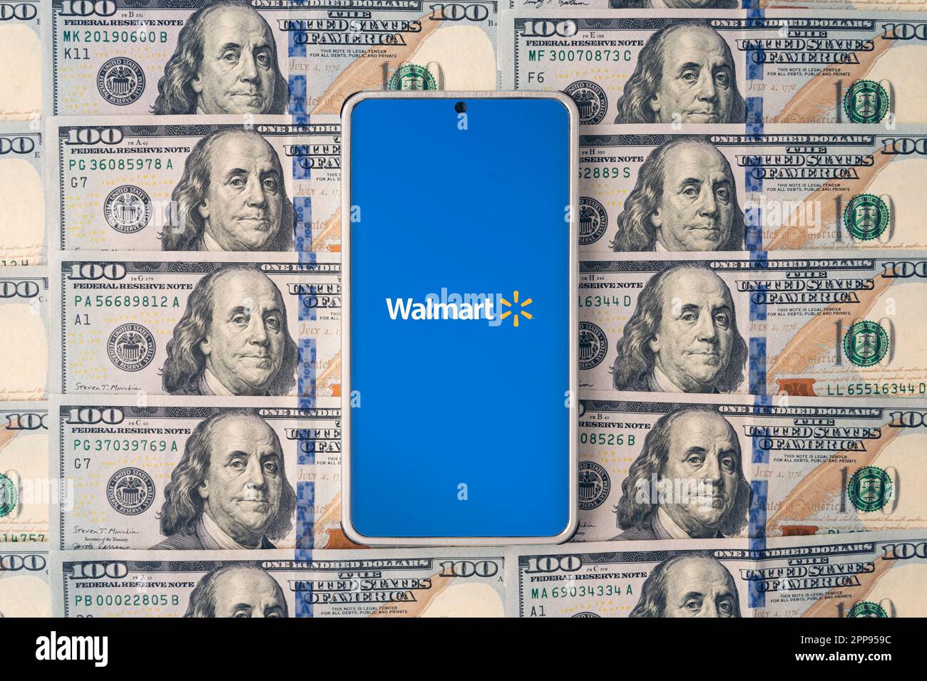the logo of the Walmart on the smartphone screen lying on American ...