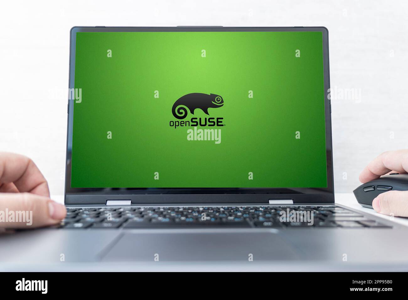 Laptop computer displaying logo of The openSUSE Project, a worldwide ...