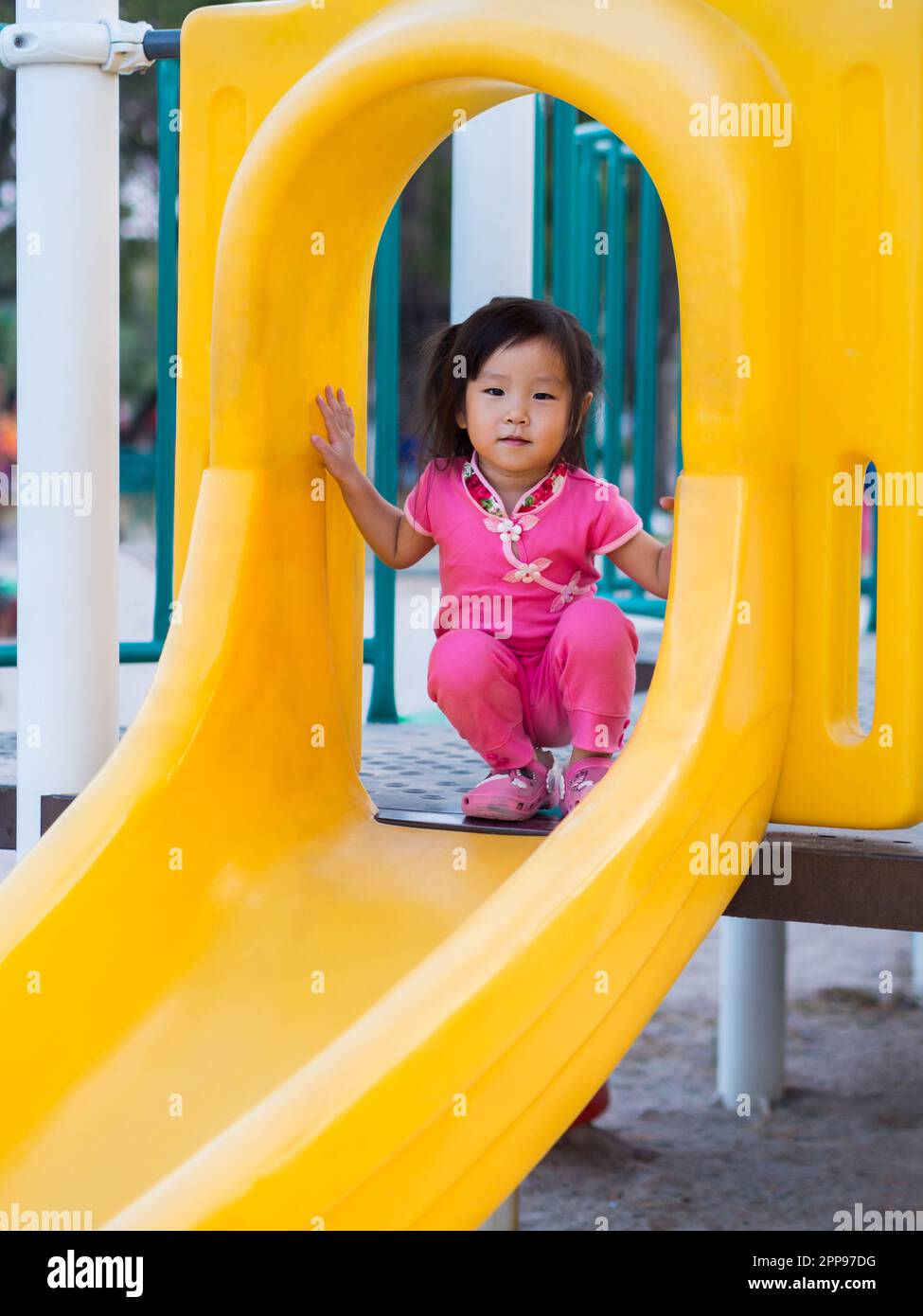 Asian baby girl playing slider hi-res stock photography and images - Alamy