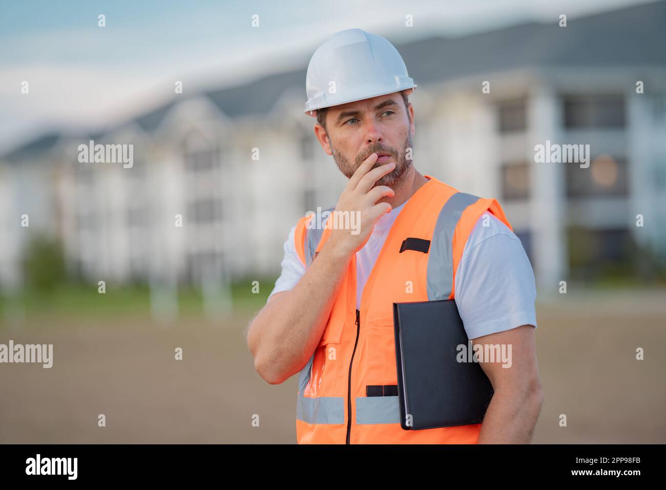 Builder thinking. Construction man in helmet build new house. Engineer ...