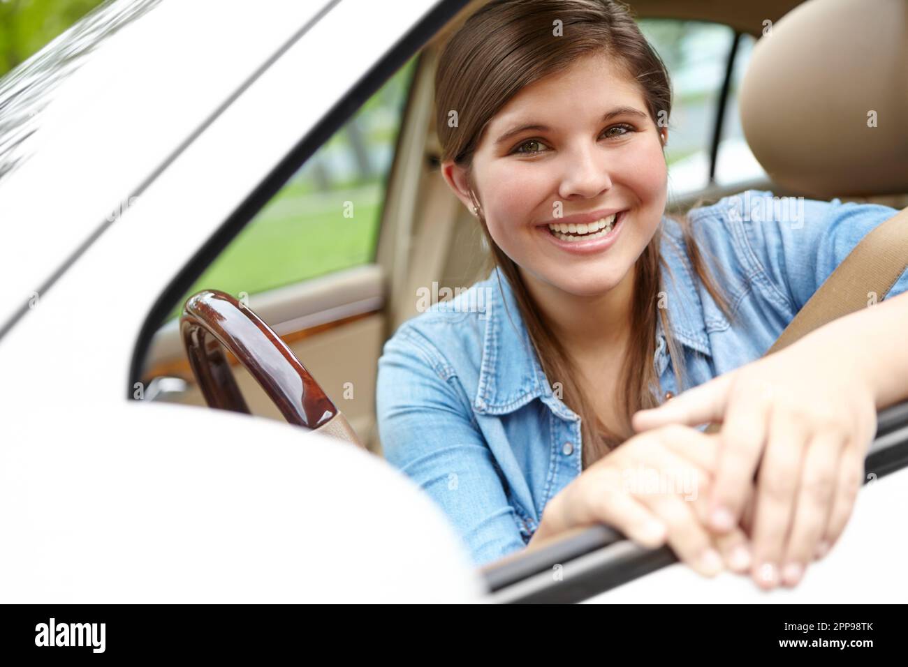 Off to her first day of college. A pretty young girl sitting behind the ...