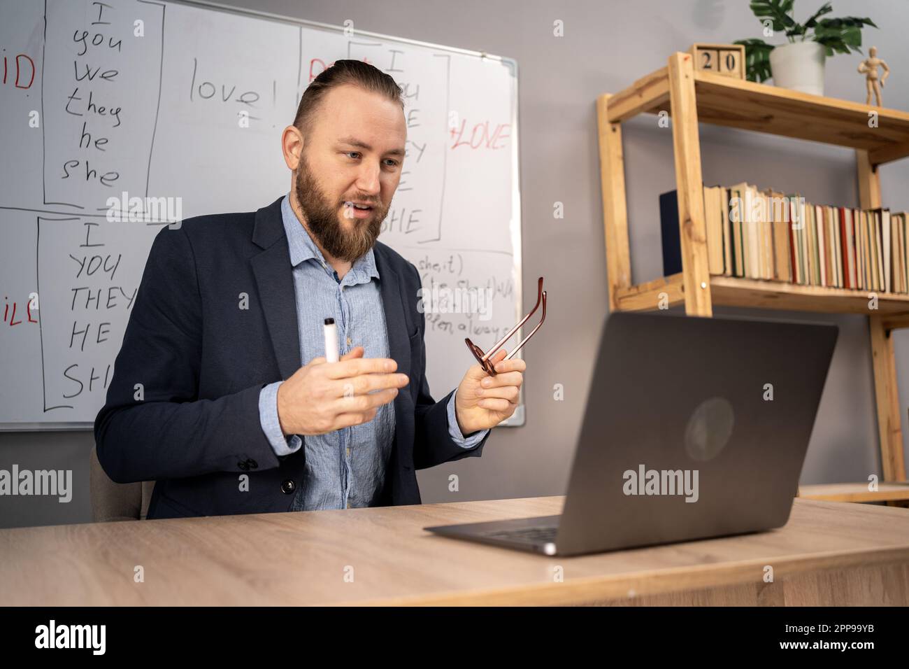 Male teacher giving English class, having on whiteboard with basic ...